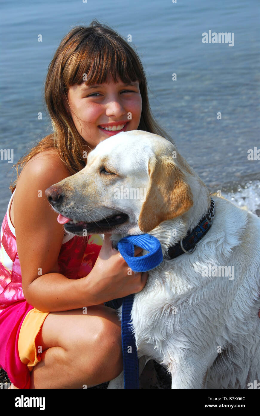 Portrait of a young girl with a dog Stock Photo - Alamy