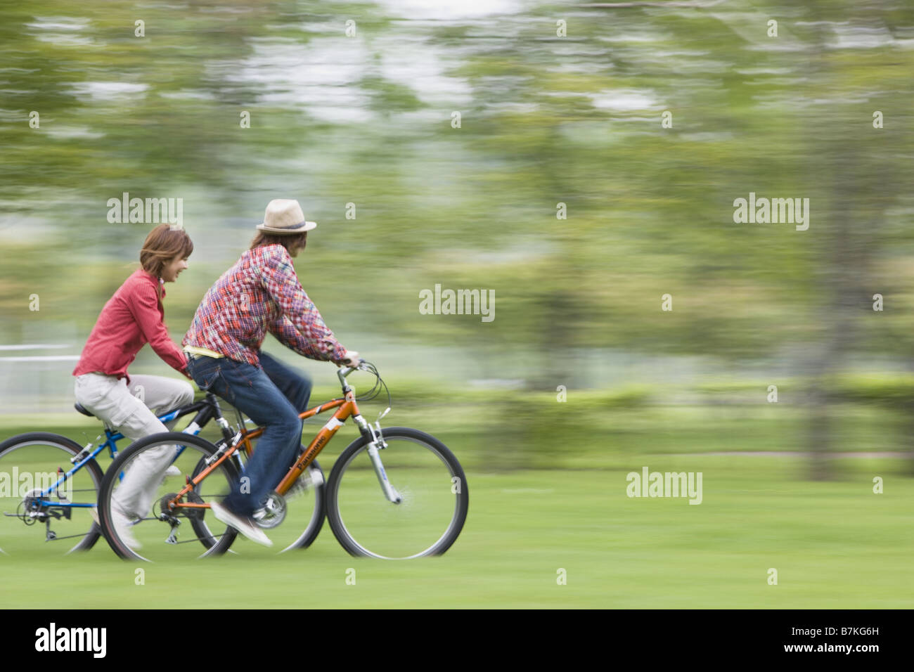 Bicycle lawn playground man woman hi-res stock photography and images ...
