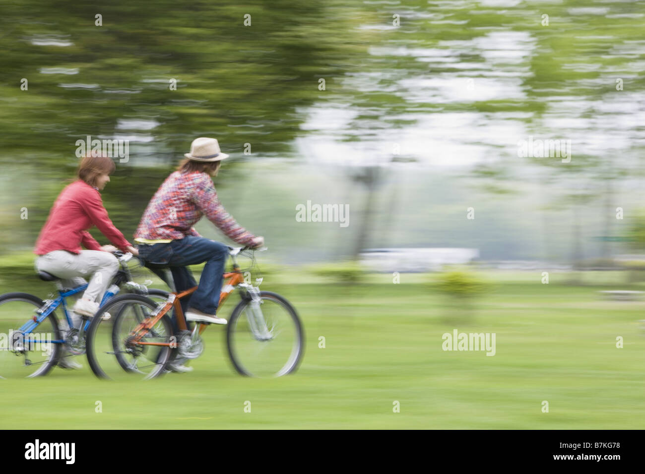 Couple Biking Together Stock Photo - Alamy