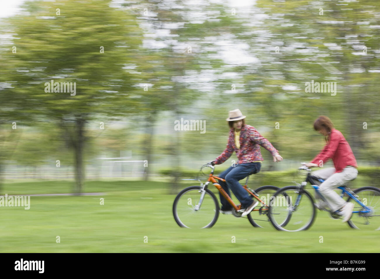 Couple Biking Together Stock Photo - Alamy