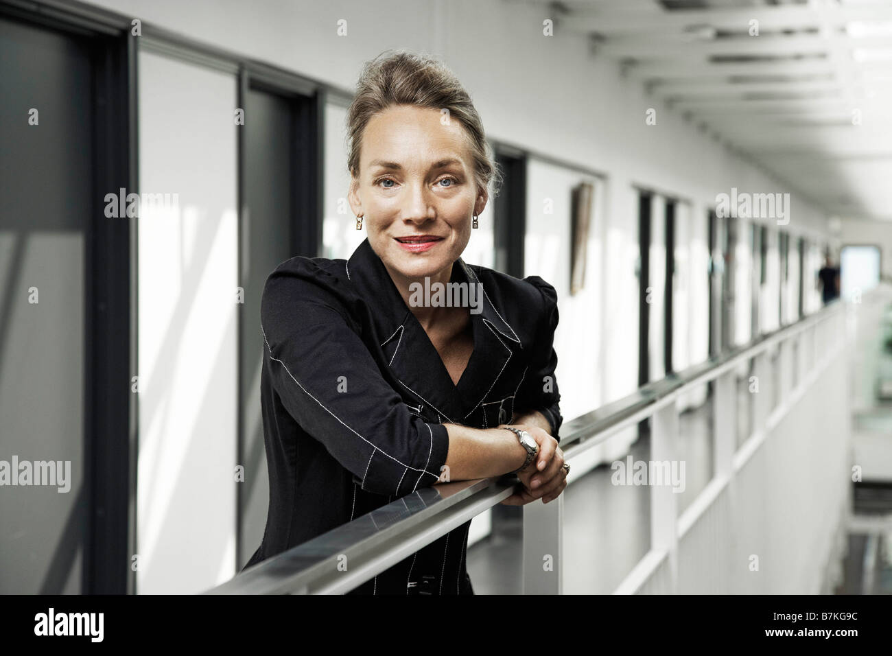 Business woman smiling Stock Photo - Alamy