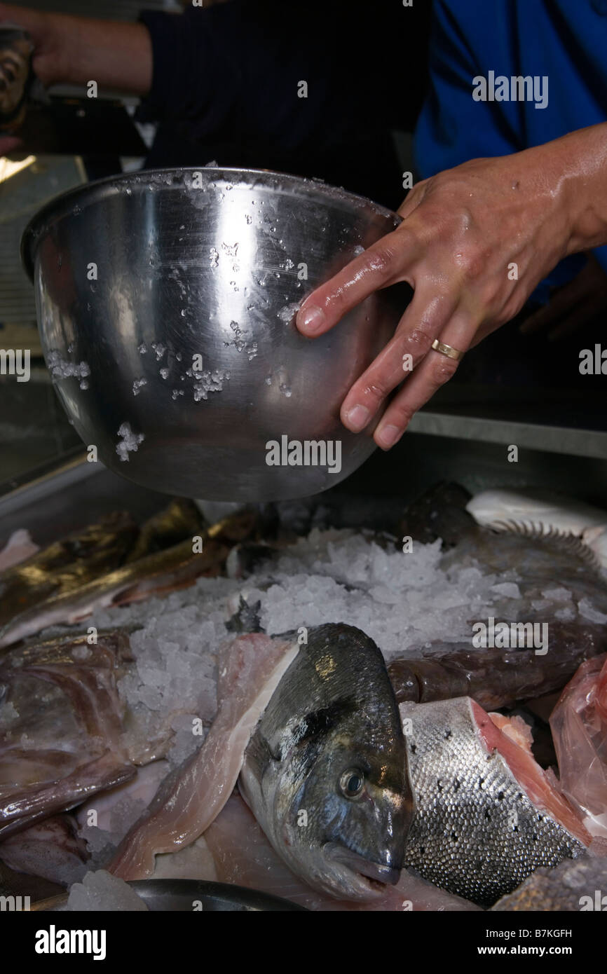A fishmonger prepares the day's catch Stock Photo - Alamy