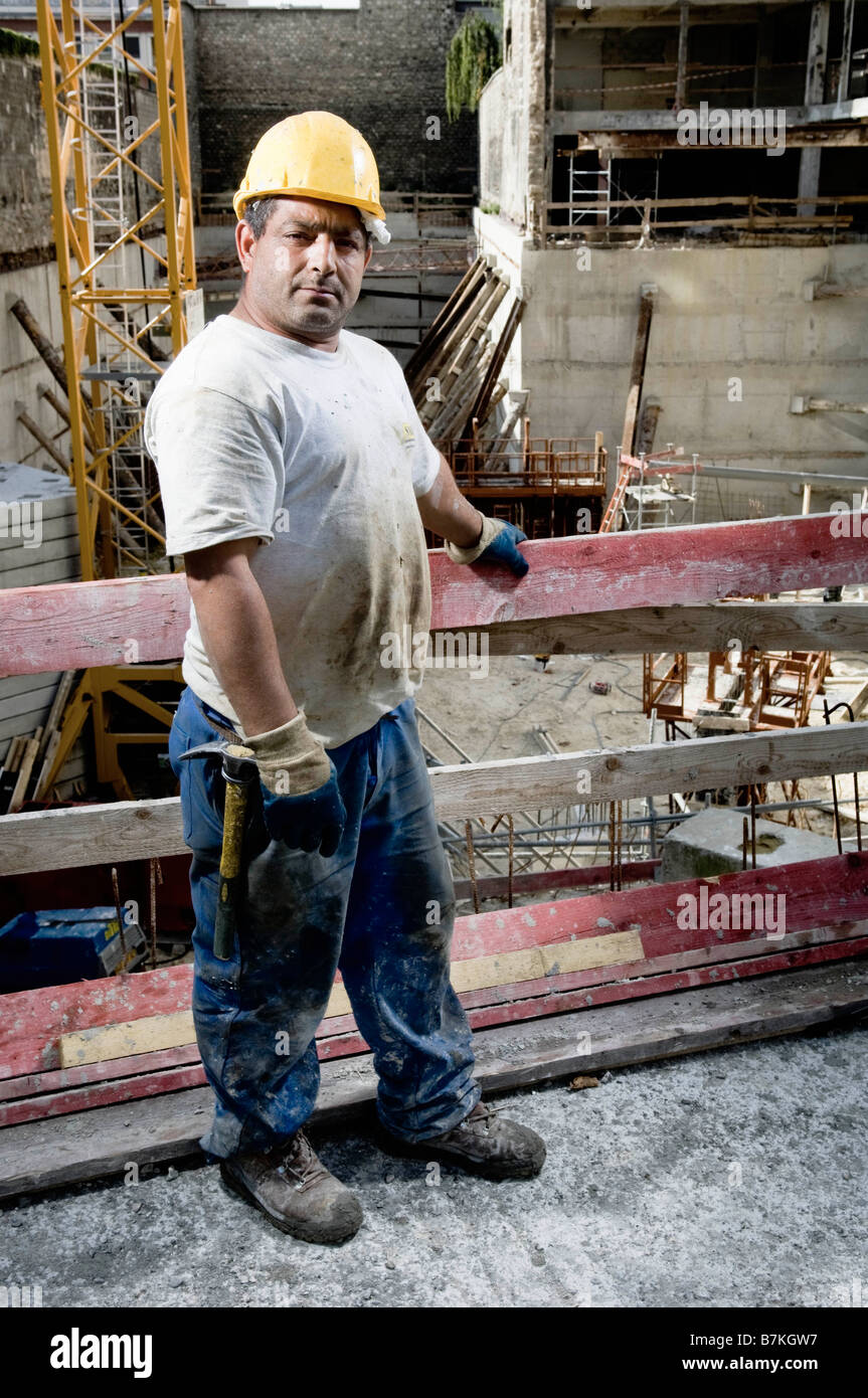 Construction worker at building site Stock Photo - Alamy