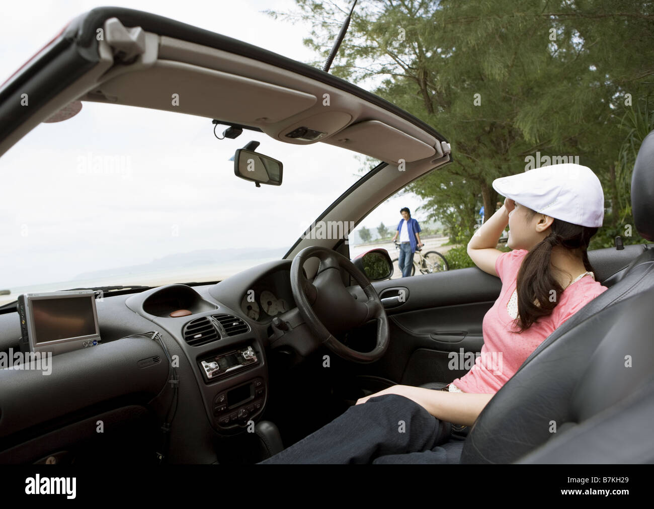 A woman in a convertible Stock Photo - Alamy