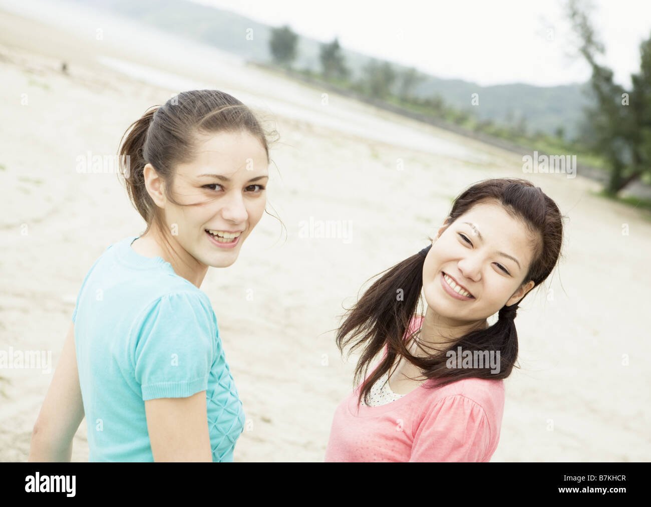 Two women smiling Stock Photo - Alamy