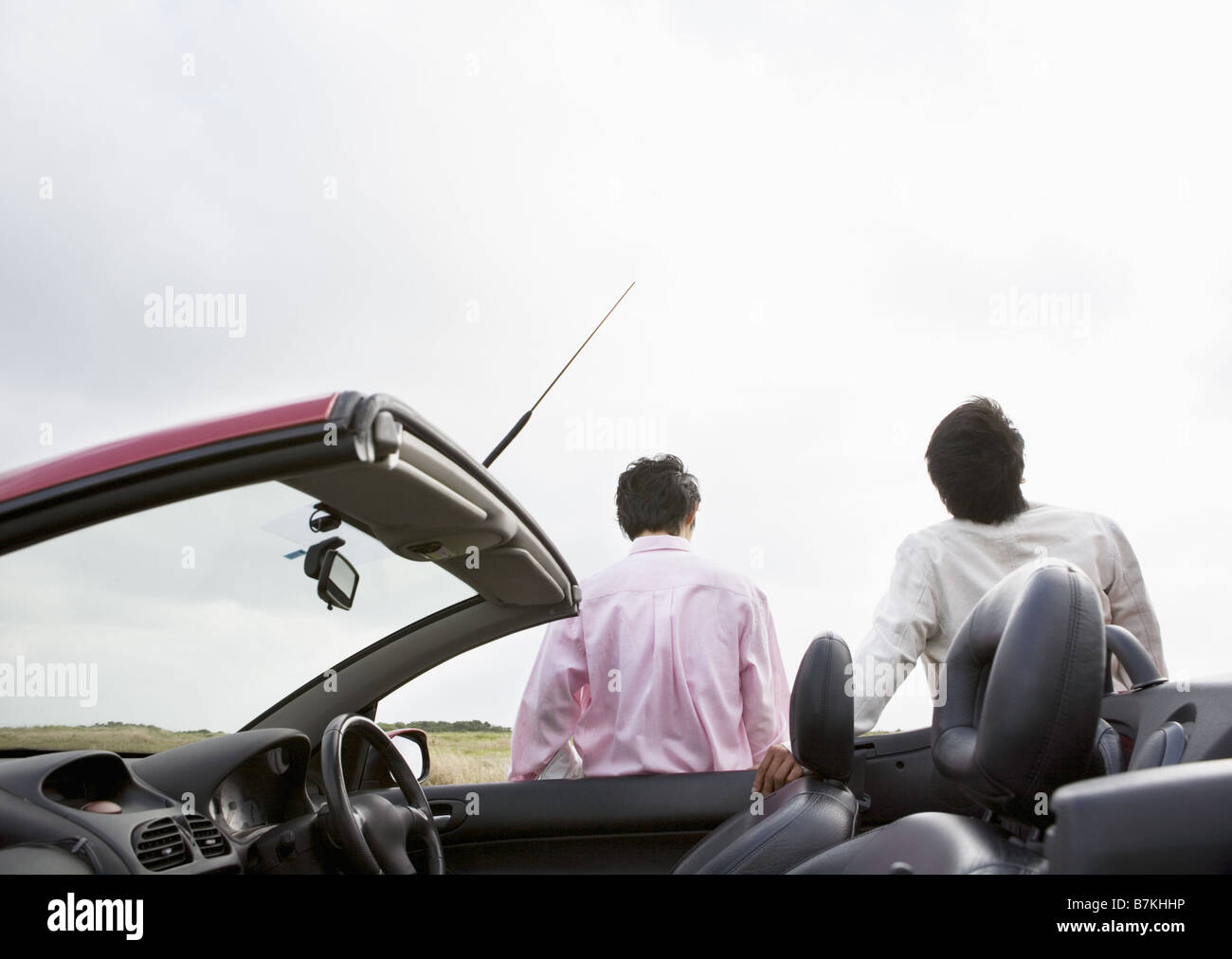 Two men with a convertible Stock Photo - Alamy