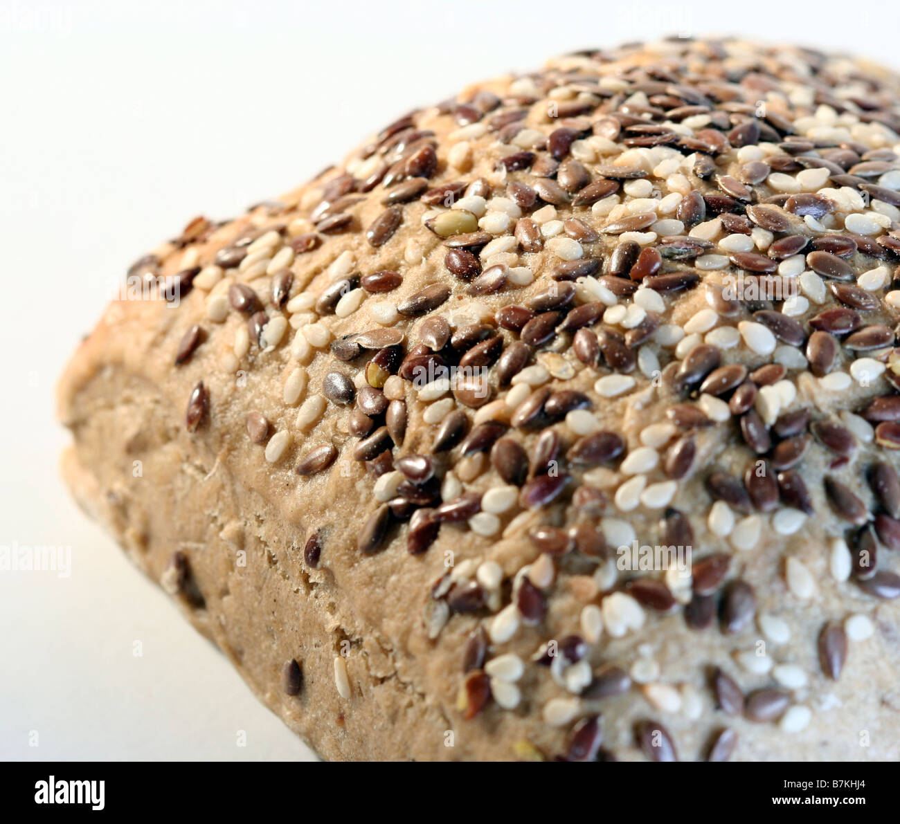 Baked bread with seeds isolated Stock Photo - Alamy