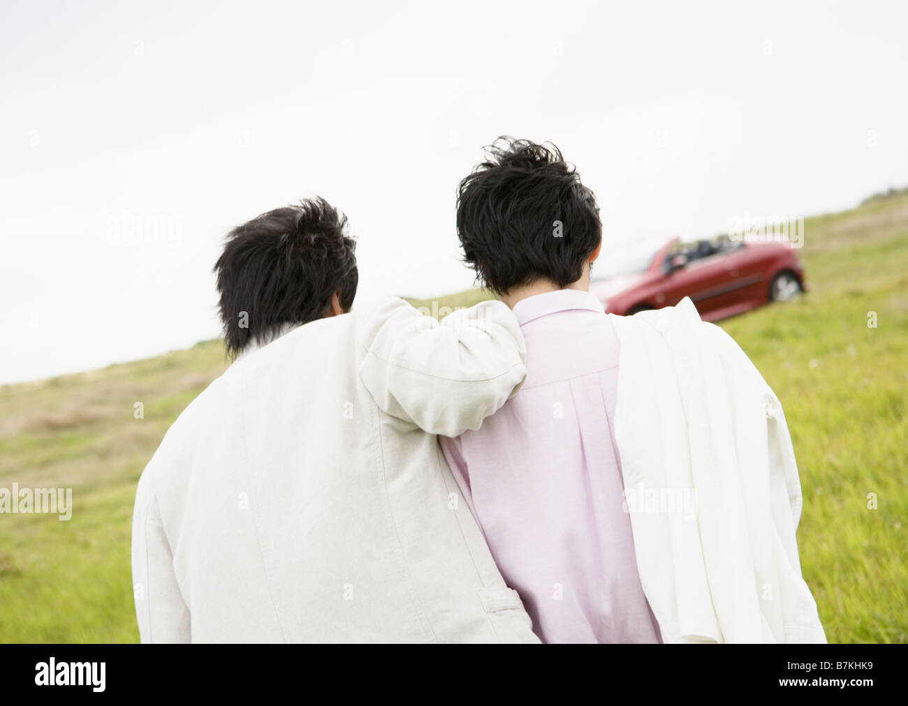 Two men in a field of grass Stock Photo - Alamy