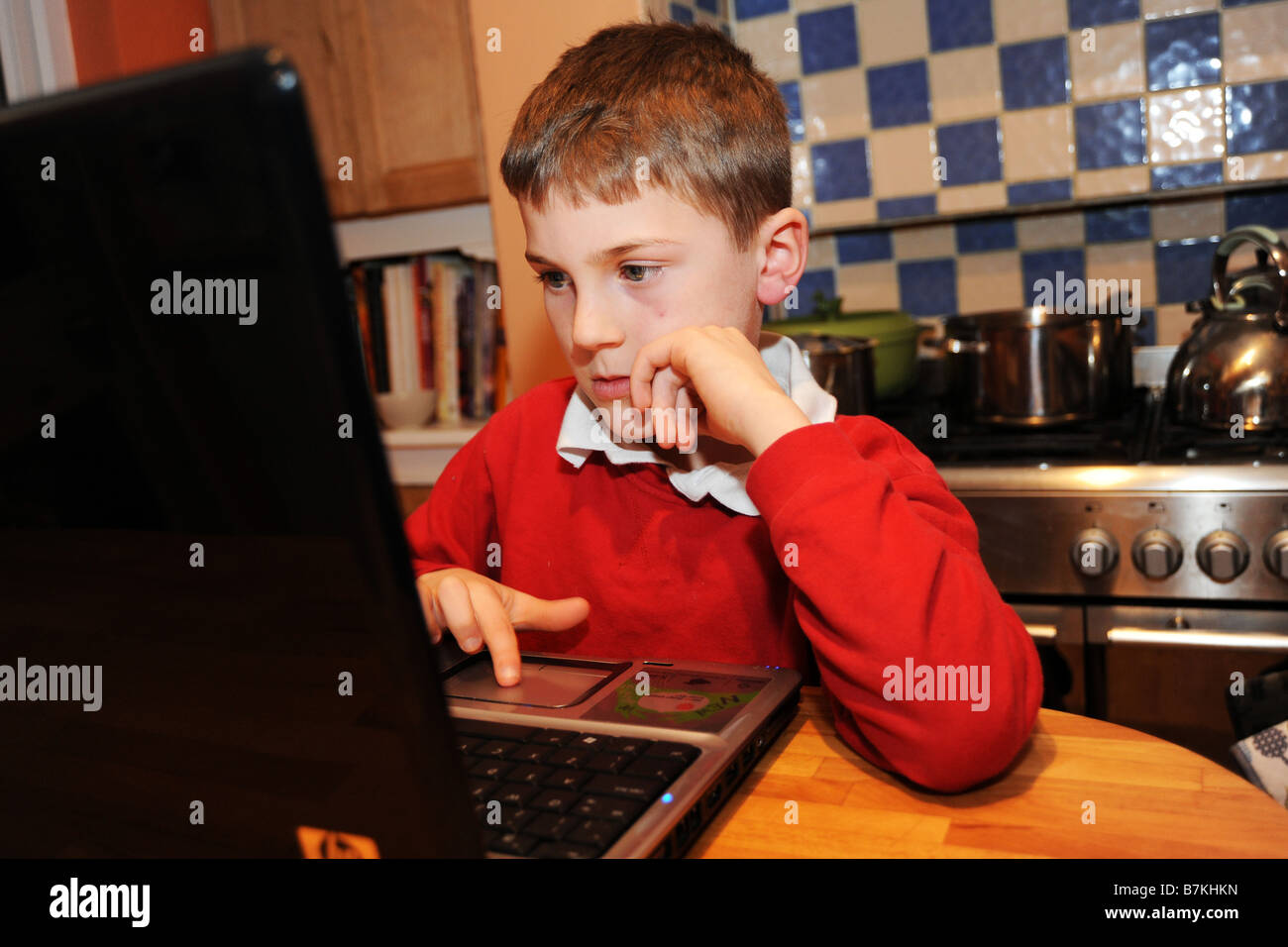 Year old boy uses computer hi-res stock photography and images - Alamy