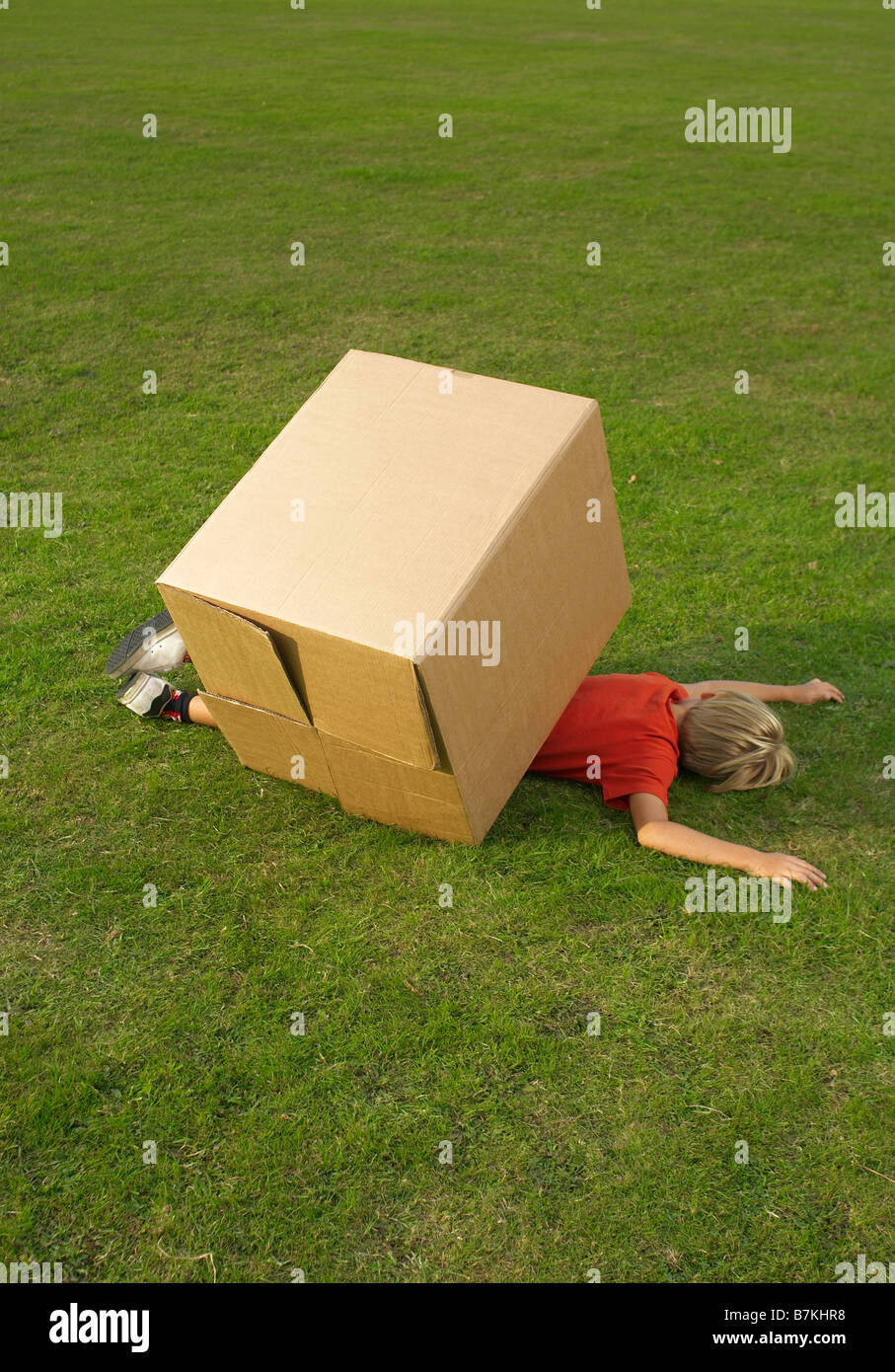 boy under box Stock Photo - Alamy
