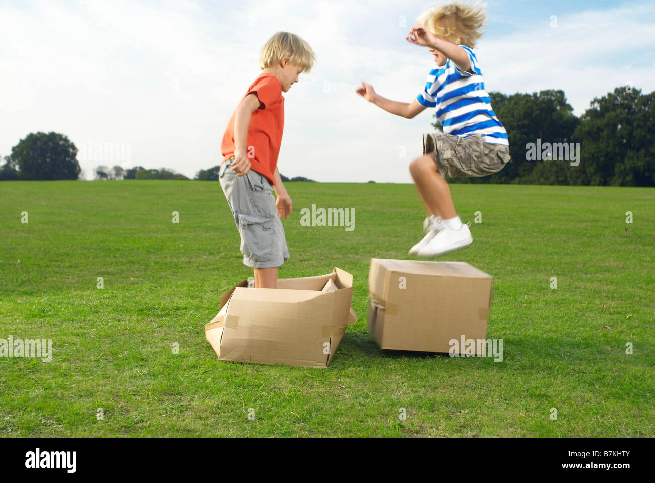 boys jumping on boxes Stock Photo - Alamy