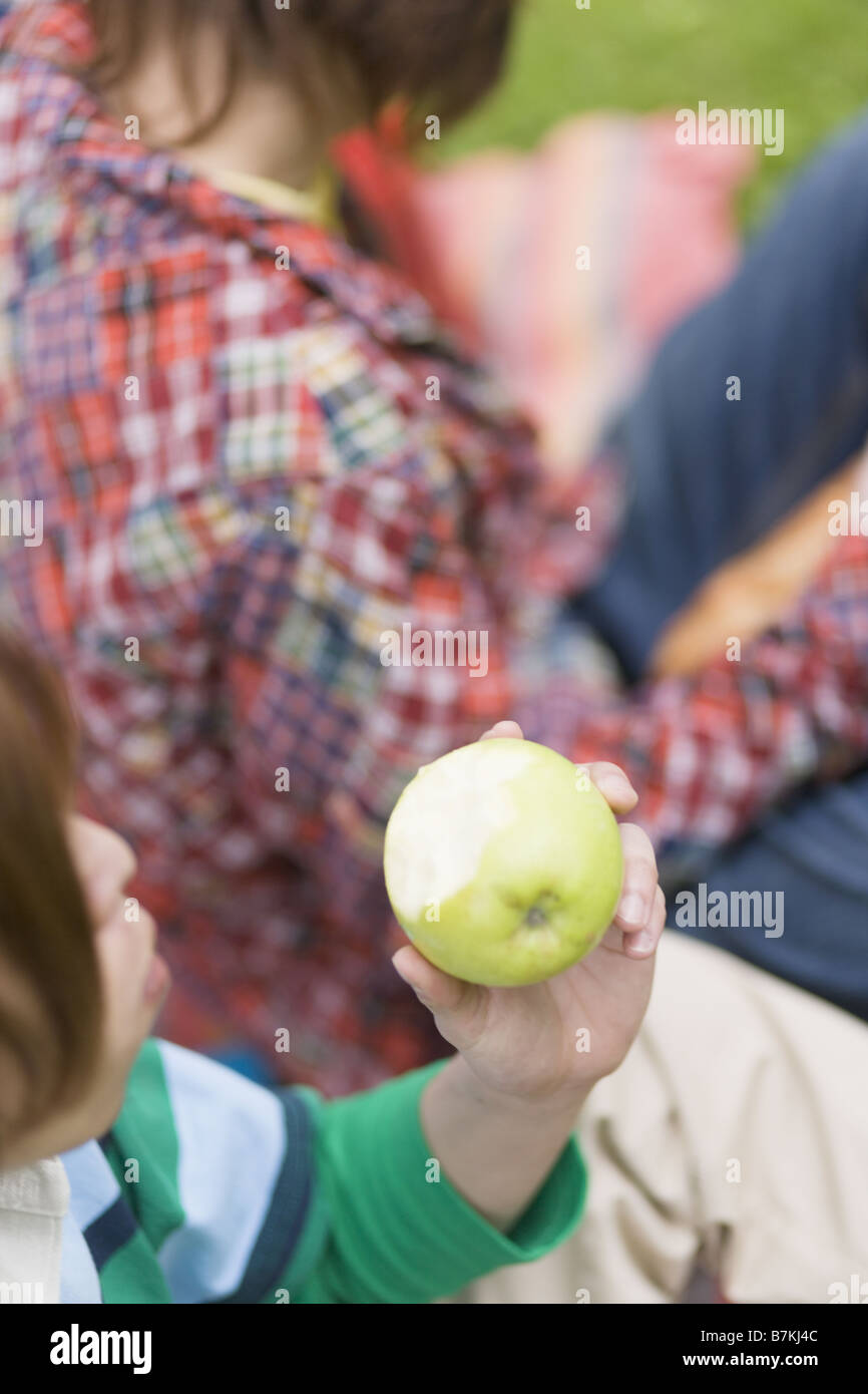 Young Man Eating an Apple Stock Photo - Alamy