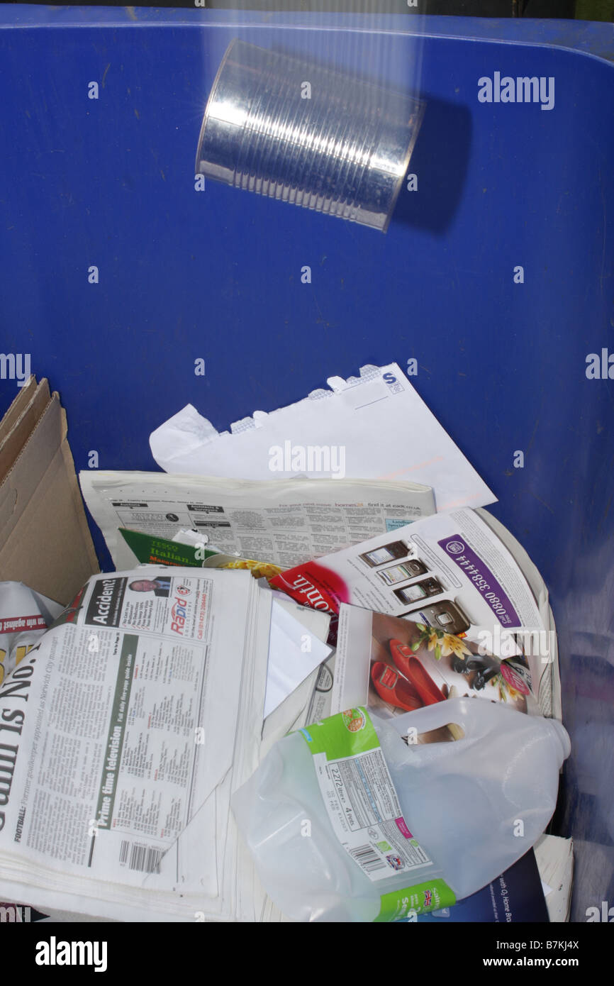 waste paper cans and plastic falling into recycle bin Stock Photo - Alamy