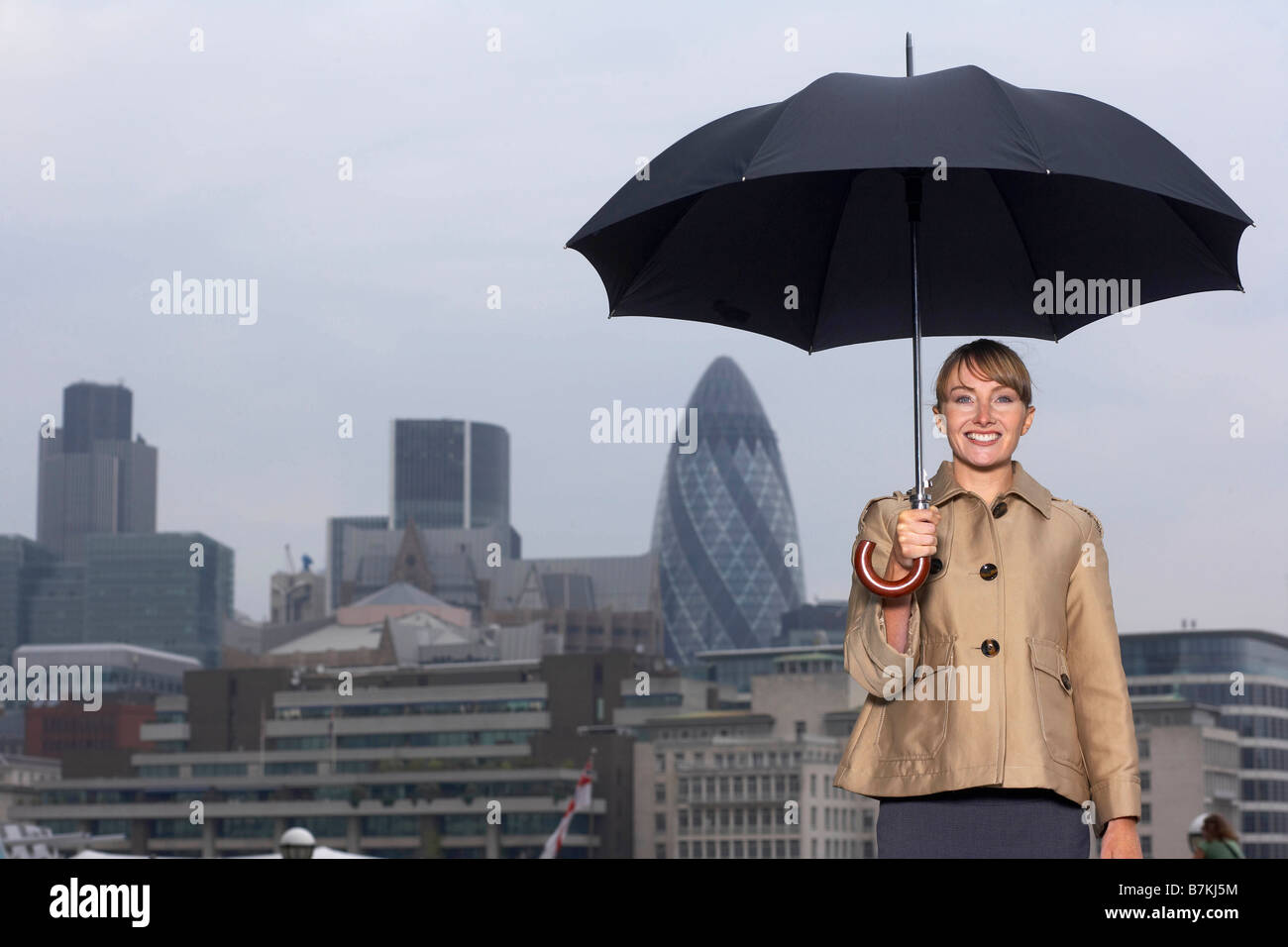 Woman with umbrella city scape Stock Photo - Alamy
