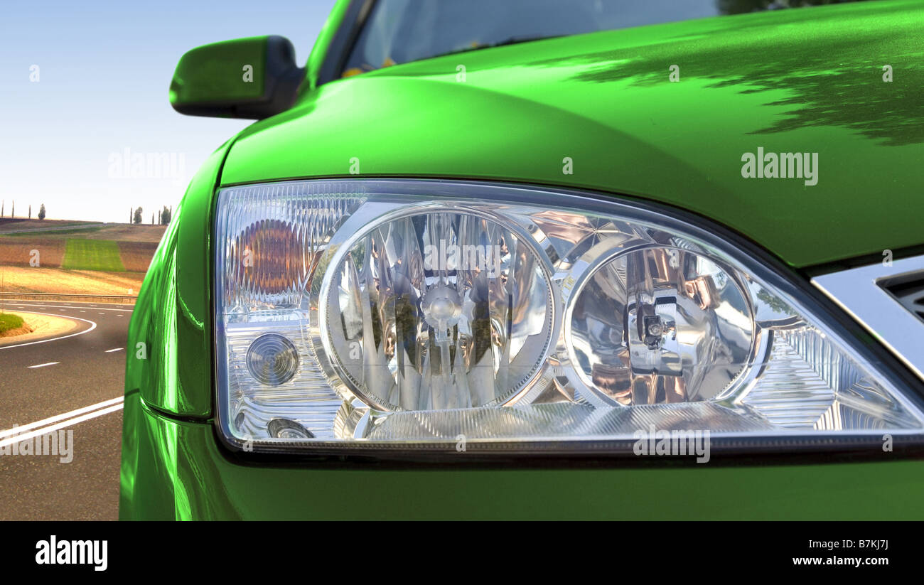 Green car on the road Stock Photo - Alamy
