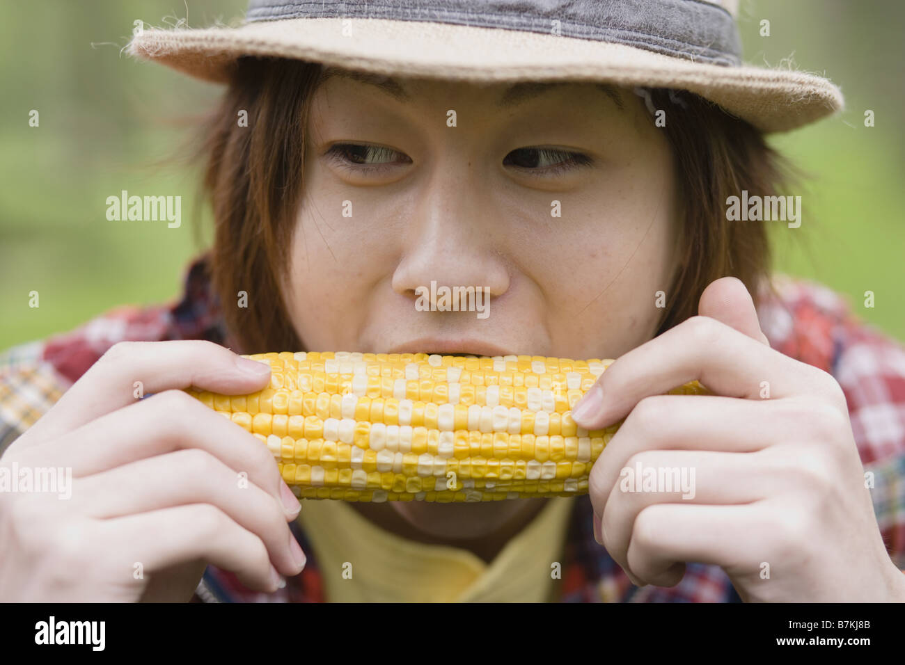 Man Eating a Boiled Corn Stock Photo - Alamy