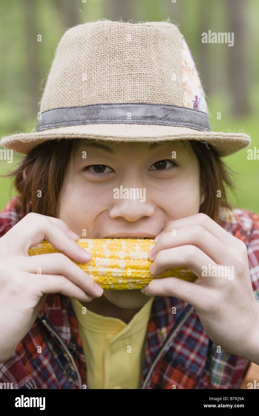Man Eating a Boiled Corn Stock Photo - Alamy