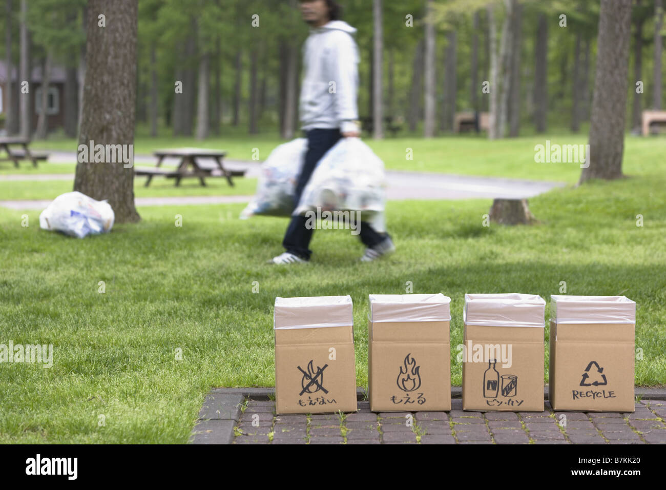 Man with Trash Bag Walking Stock Photo - Alamy