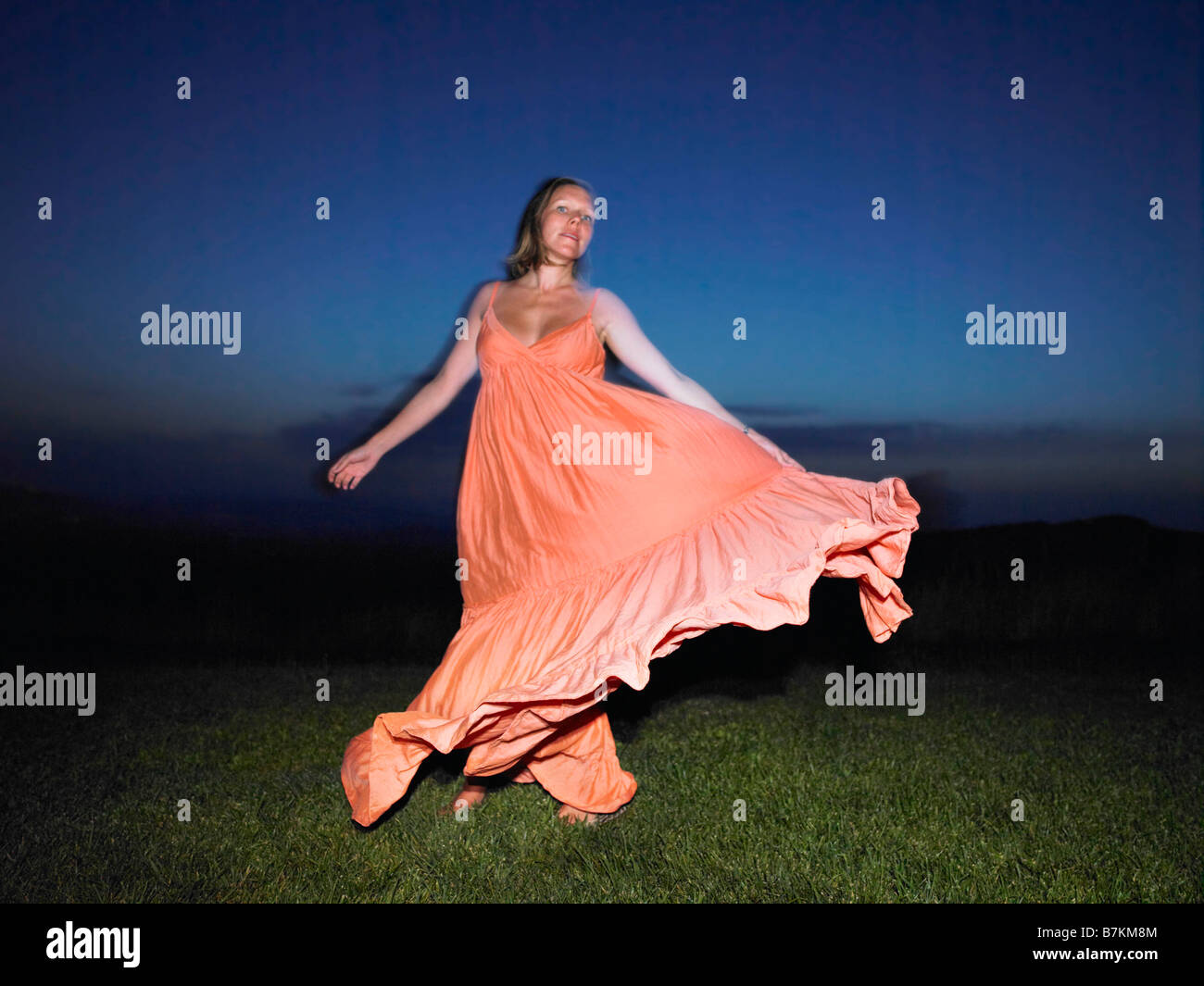 Woman dancing in the dark Stock Photo - Alamy