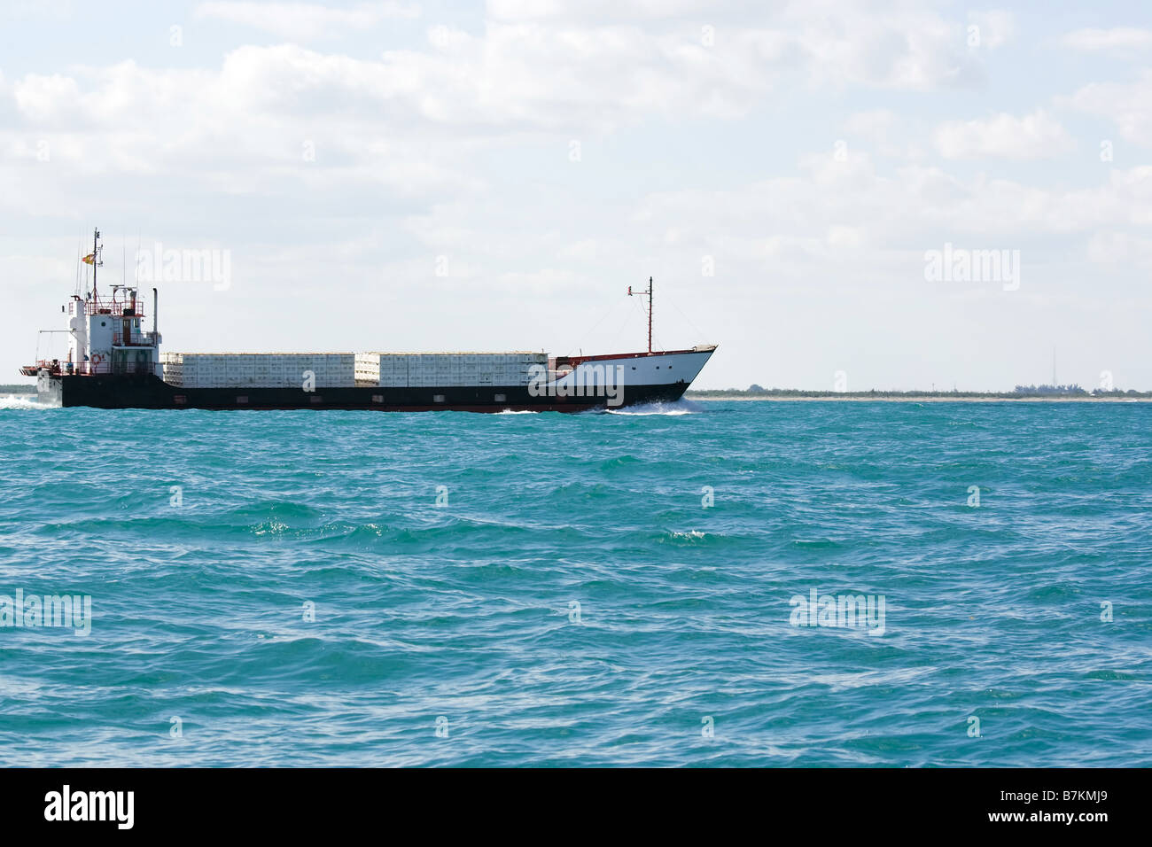 local island cargo trading ship near coast Stock Photo - Alamy