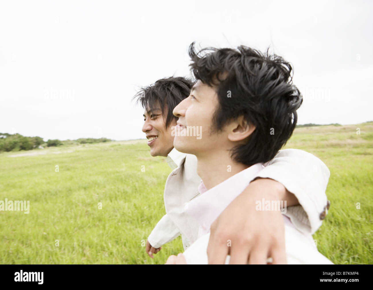 Two young men smiling Stock Photo - Alamy
