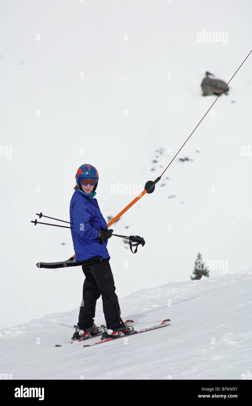 girl going up ski lift Stock Photo - Alamy