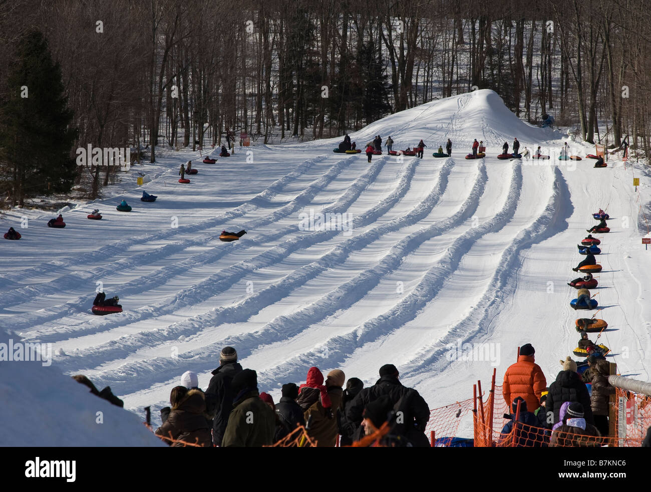 Riding tubes down a hill Stock Photo - Alamy