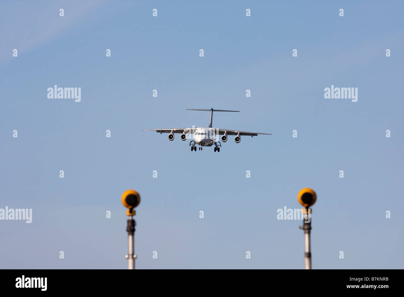 small four engine jet aircraft on final approach to land Stock Photo ...