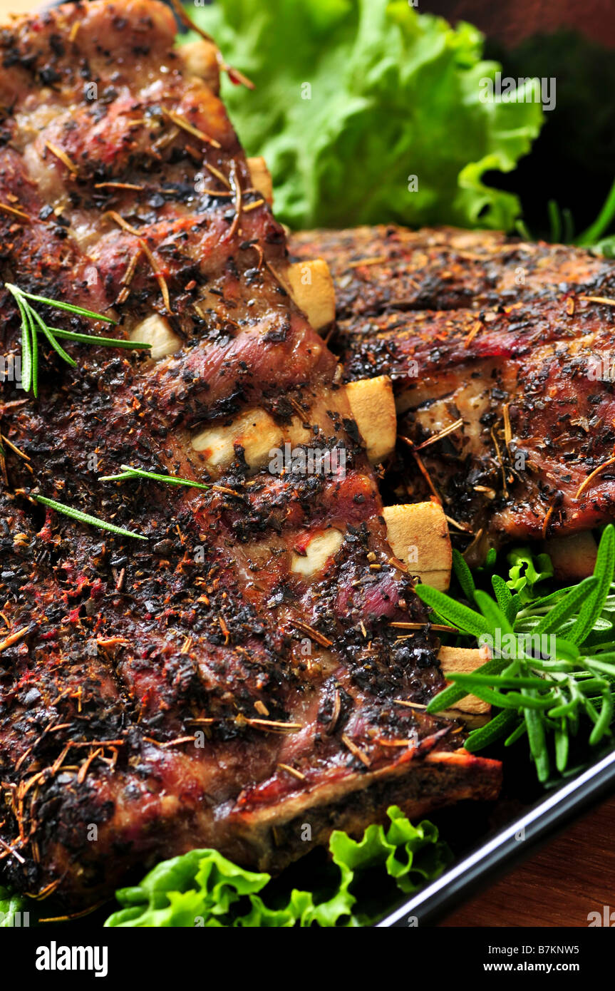 Plate of spare ribs and greens for dinner Stock Photo - Alamy