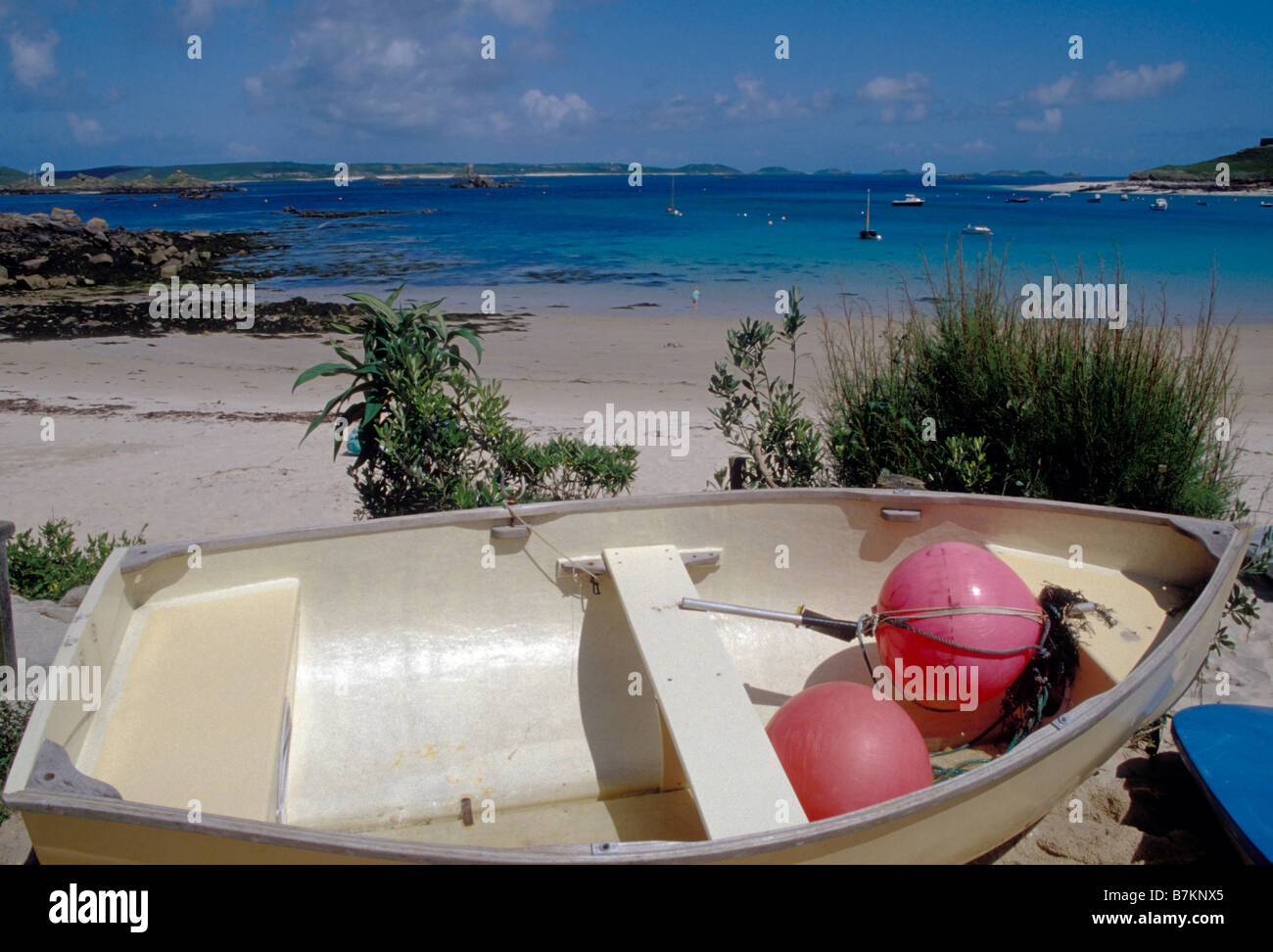 A moored rowing boat on the beach at Green Porth Old Grimsby. Tresco ...