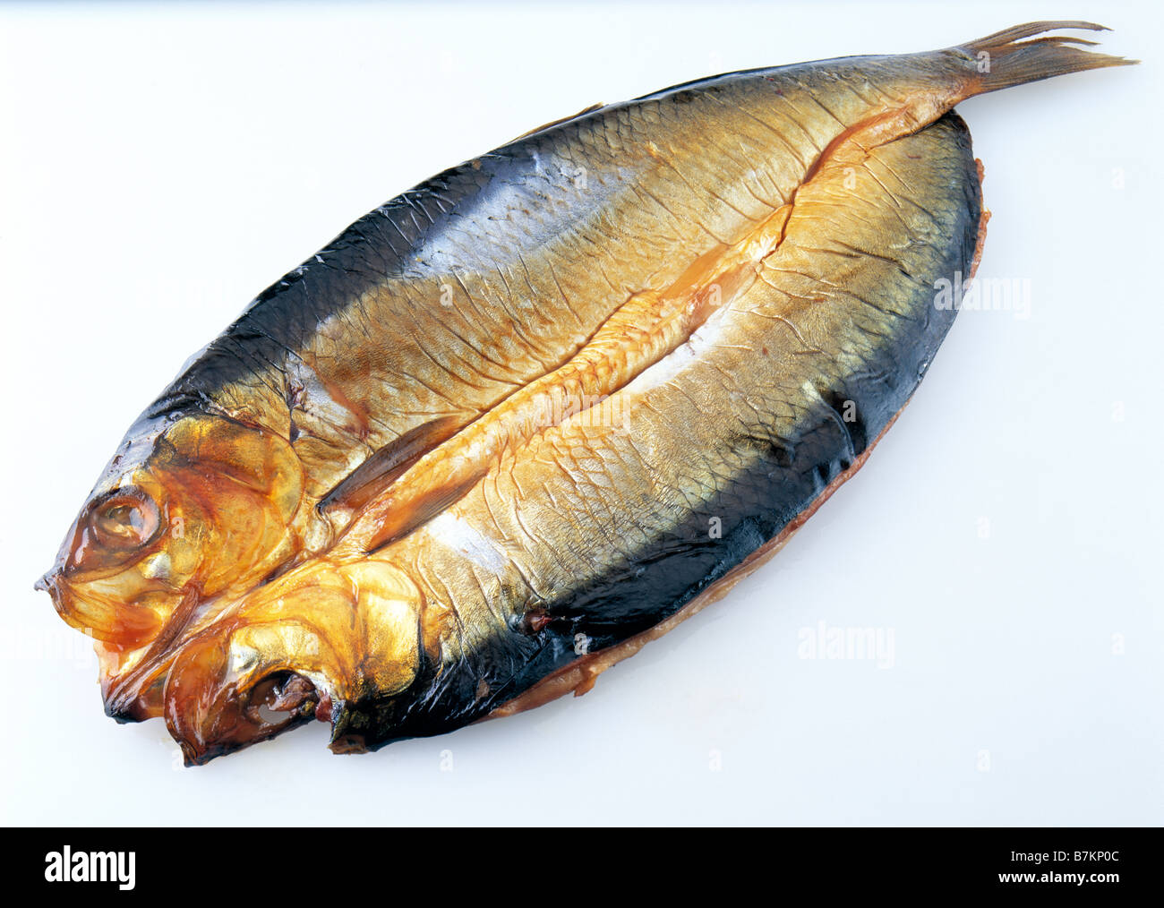 Raw kippers on a white background Stock Photo - Alamy