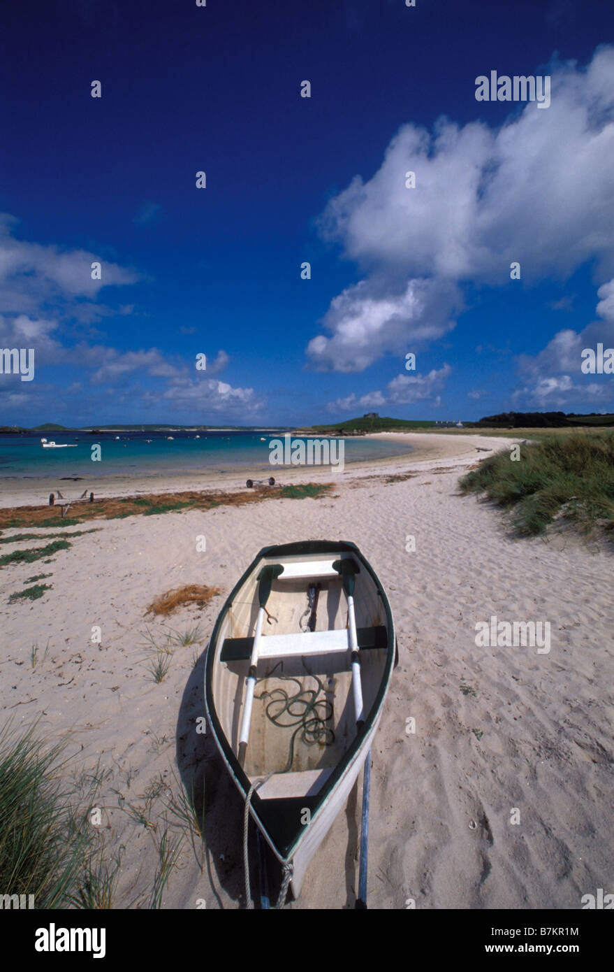 A moored rowing boat on the sandy beach at Green Porth, Old Grimsby ...