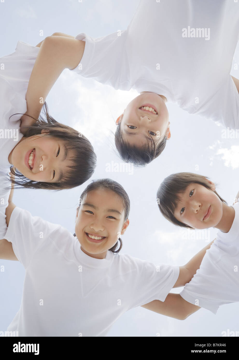 Elementary school students making a circle Stock Photo - Alamy