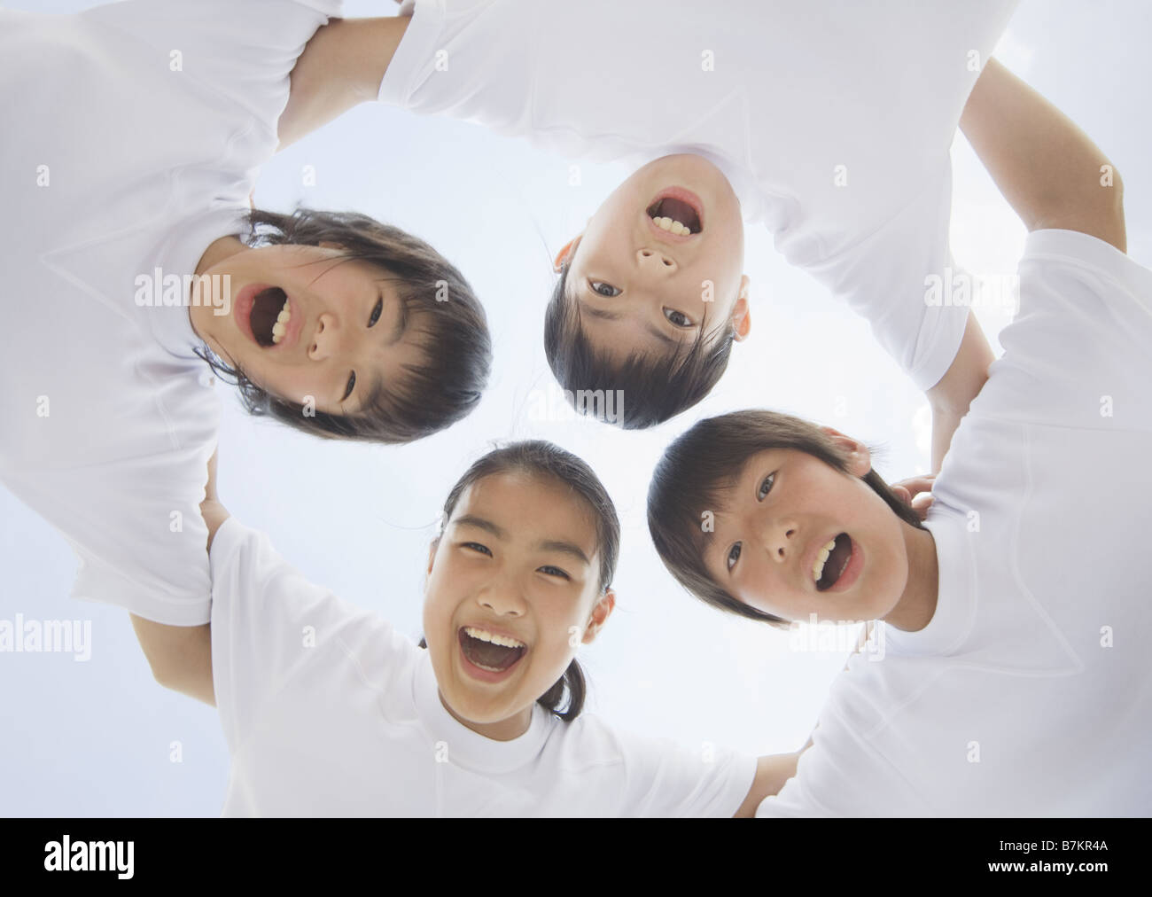 Elementary school students making a circle Stock Photo - Alamy