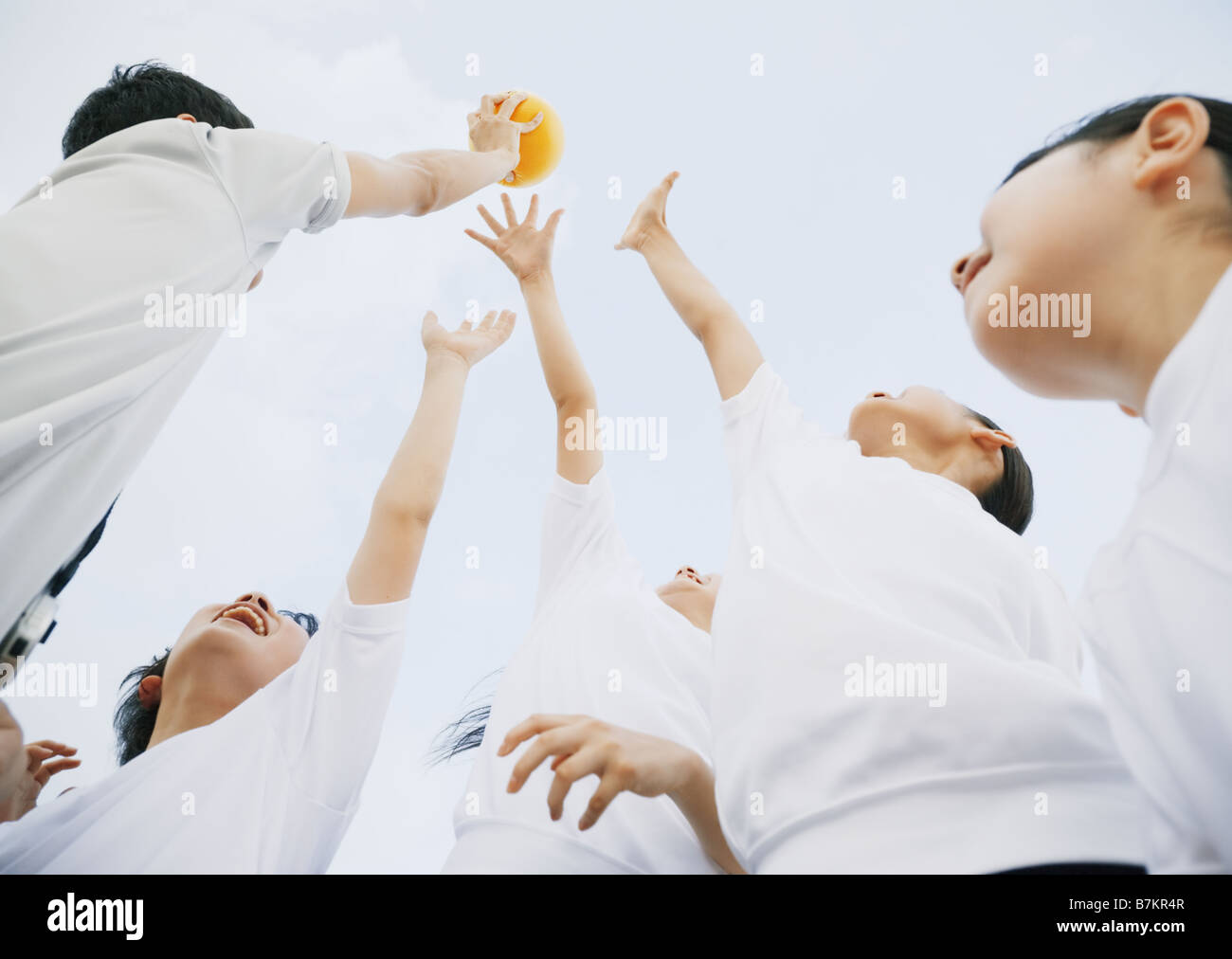 Elementary school students catching a ball Stock Photo - Alamy