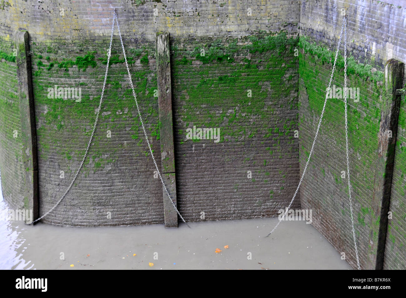 Ancient riverside brick wall Stock Photo - Alamy
