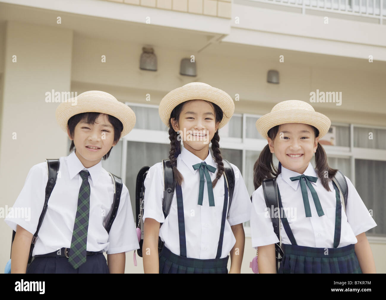 Elementary school students standing side-by-side Stock Photo - Alamy