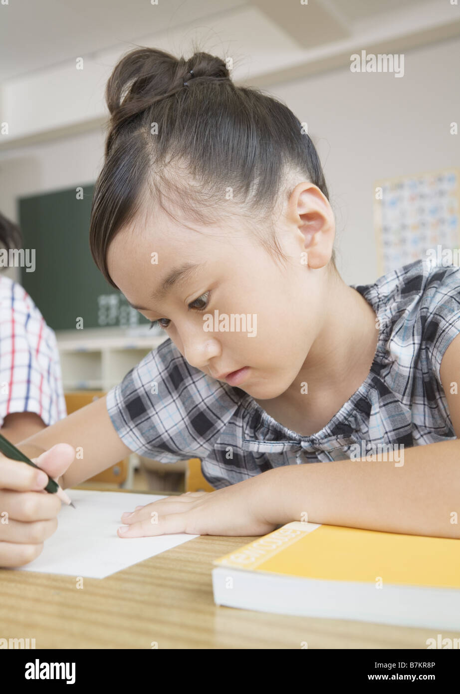 Elementary school girl at school Stock Photo - Alamy