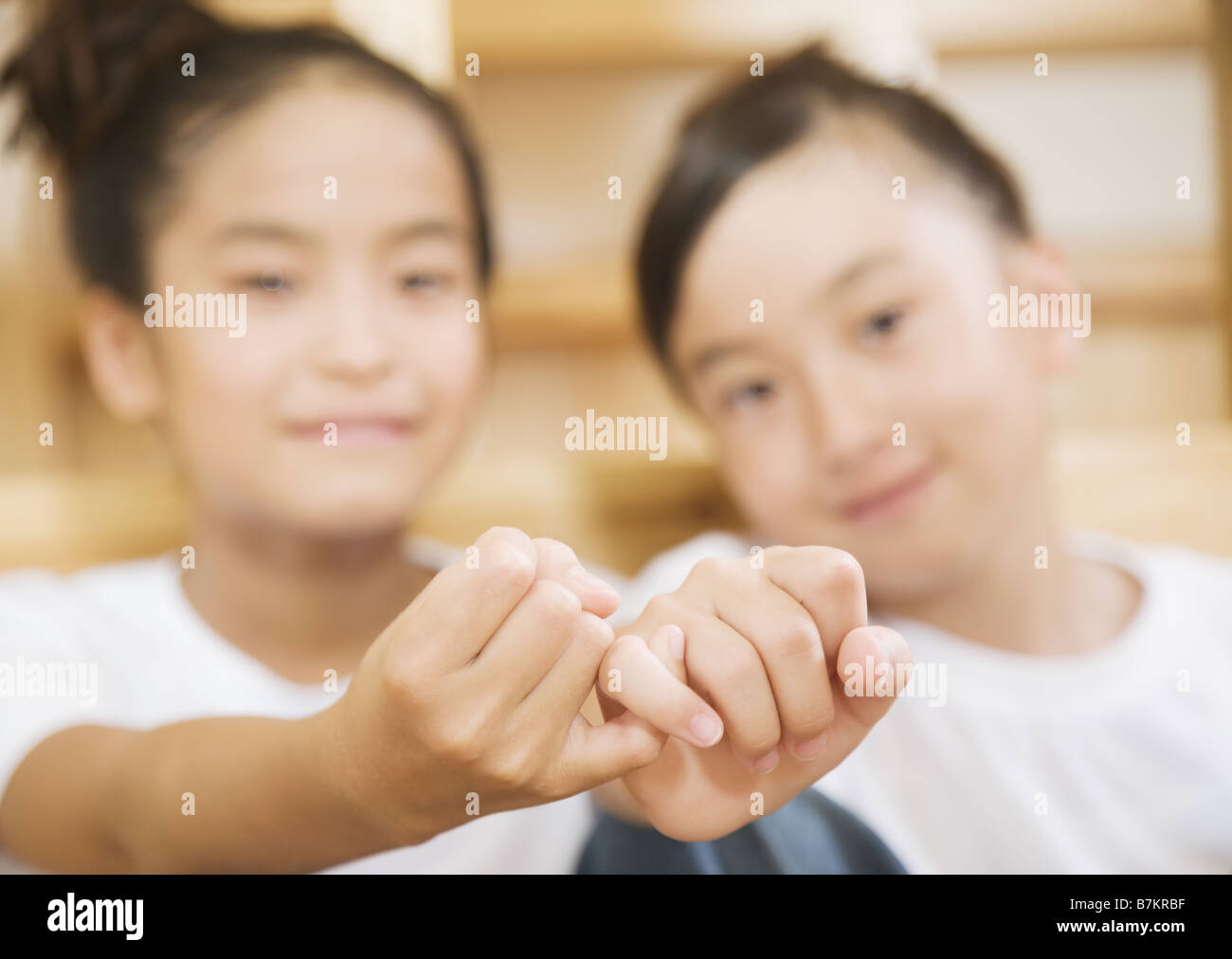 Elementary school students doing Yubikiri Stock Photo - Alamy