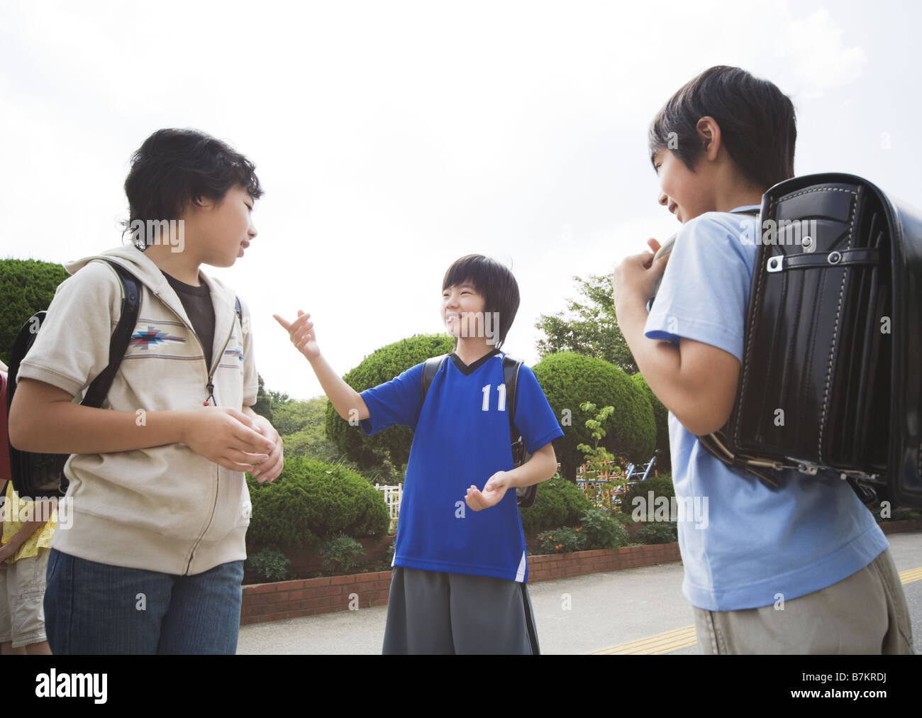 Elementary school students chatting Stock Photo - Alamy