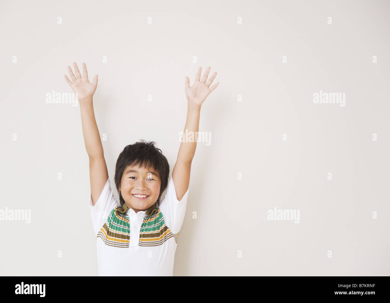 Elementary school boy opening arms Stock Photo - Alamy