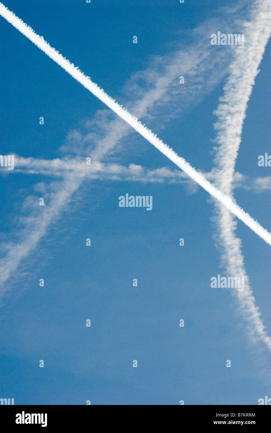 Condensation trails in sky, low angle view Stock Photo - Alamy