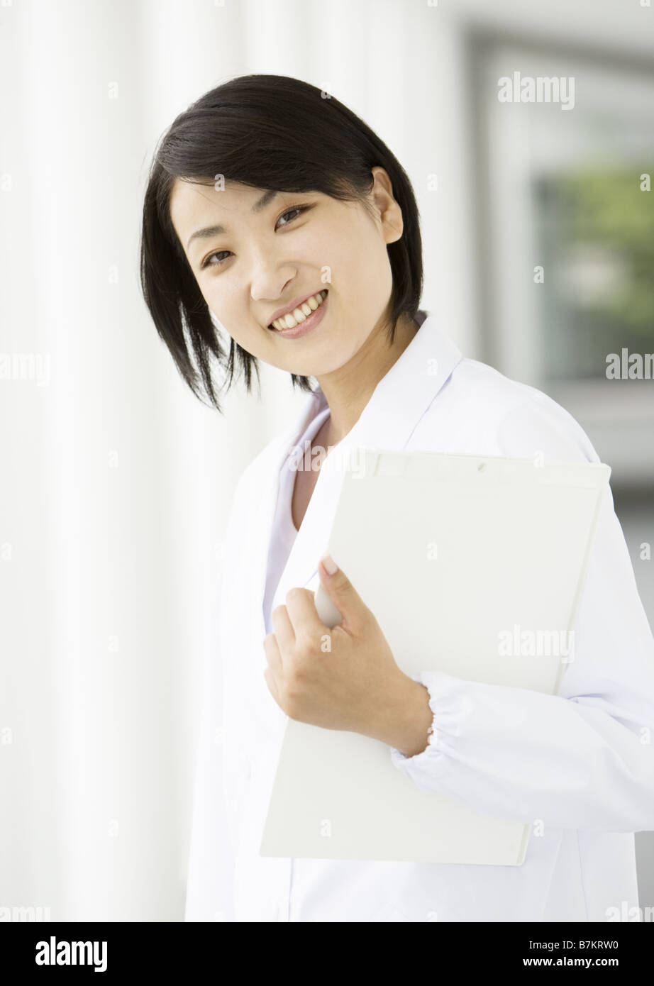 A smiling woman doctor Stock Photo - Alamy