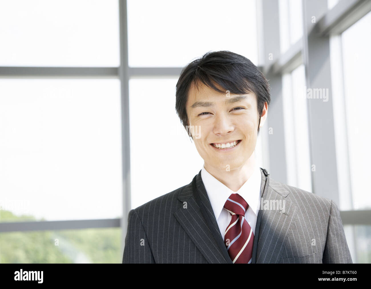 A smiling businessman Stock Photo - Alamy