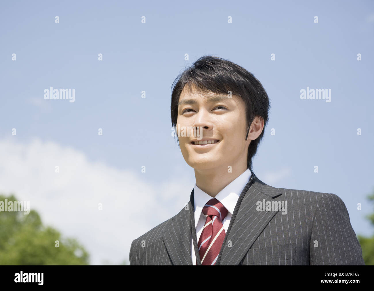 A smiling businessman Stock Photo - Alamy
