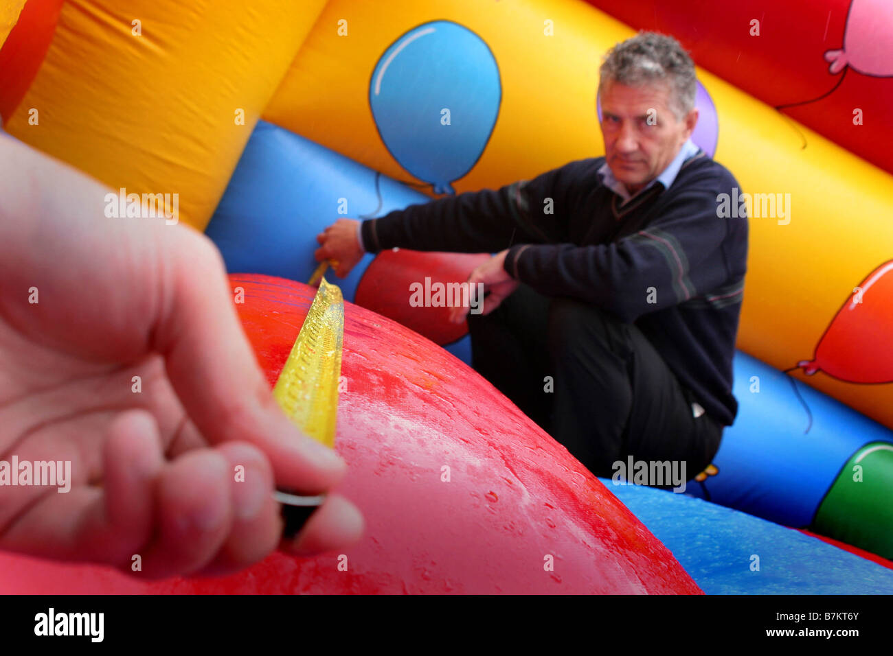 An inspector for PIPA checks an inflatable castle meets regulations ...