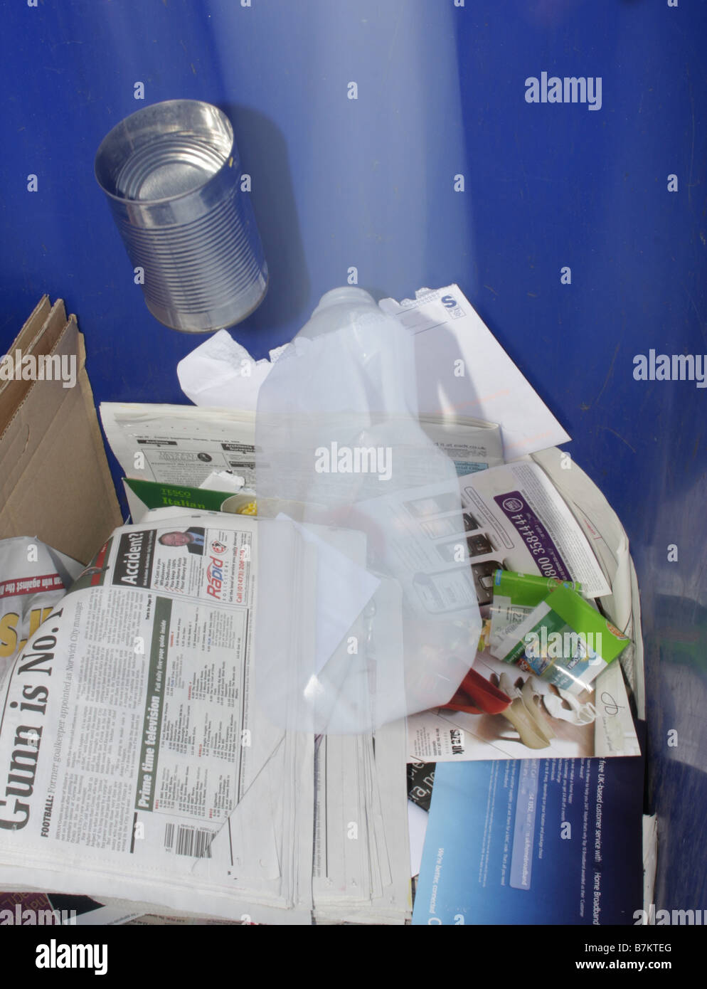 waste paper cans and plastic falling into recycle bin Stock Photo - Alamy