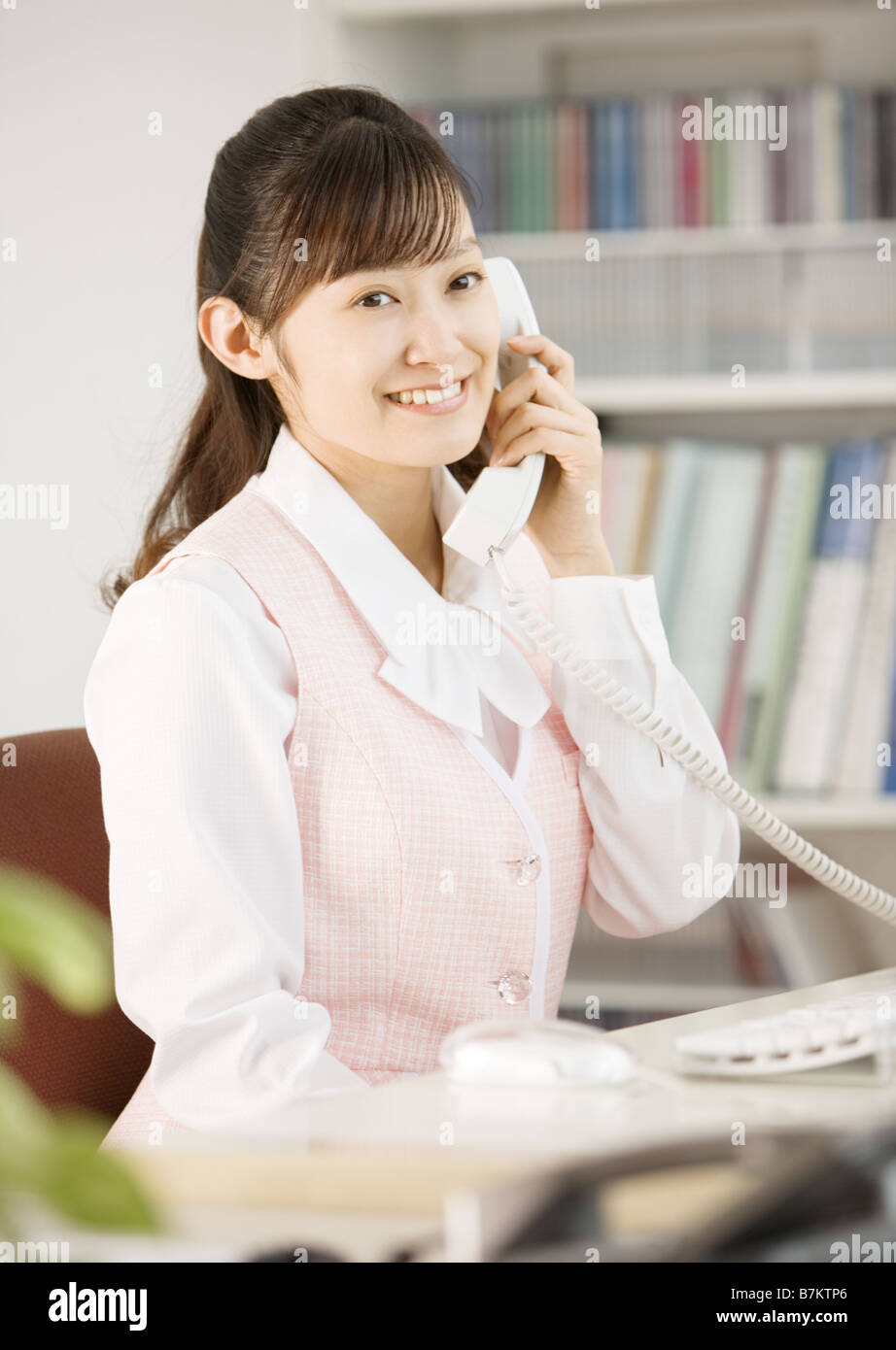An office worker making a call Stock Photo - Alamy
