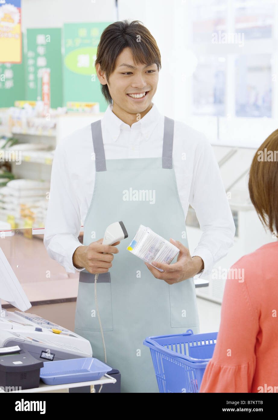 A supermarket store clerk Stock Photo - Alamy