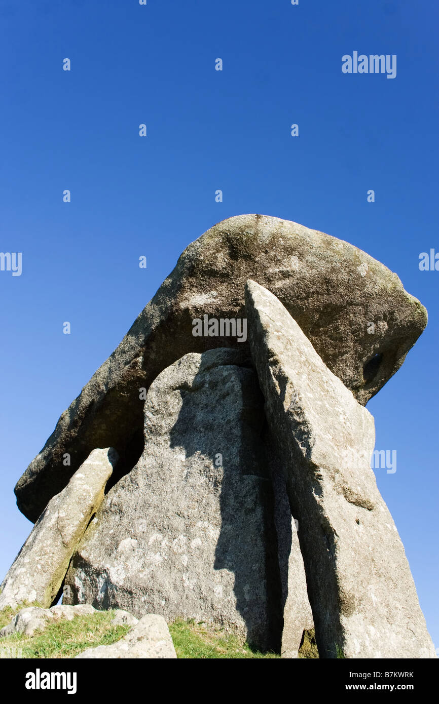 ancient stone monument in grass field with blue sky Stock Photo - Alamy